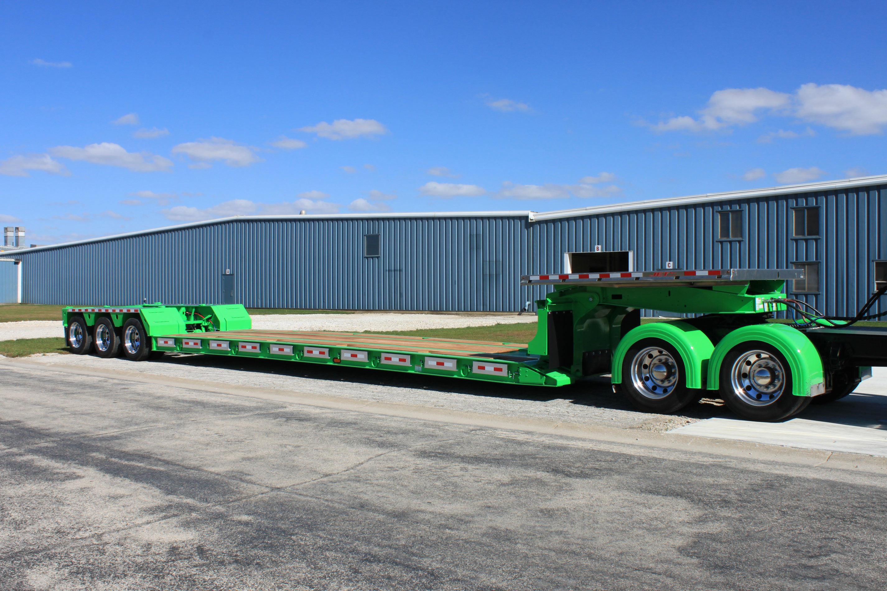 Detachable Gooseneck Lowboy Trailer Green Triple Axle curb view Jet